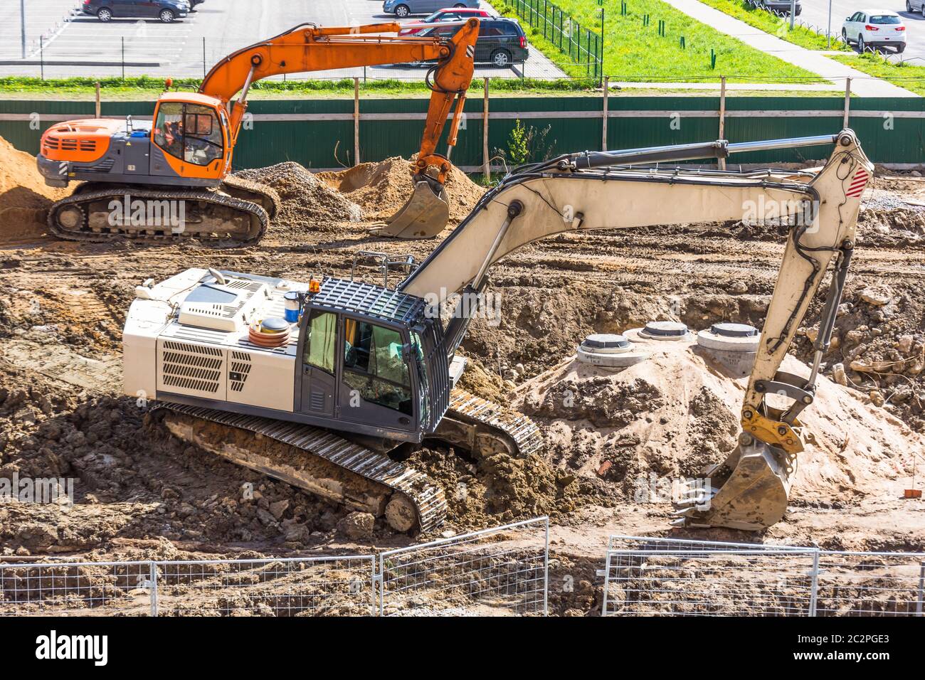 Two excavators hi-res stock photography and images - Alamy