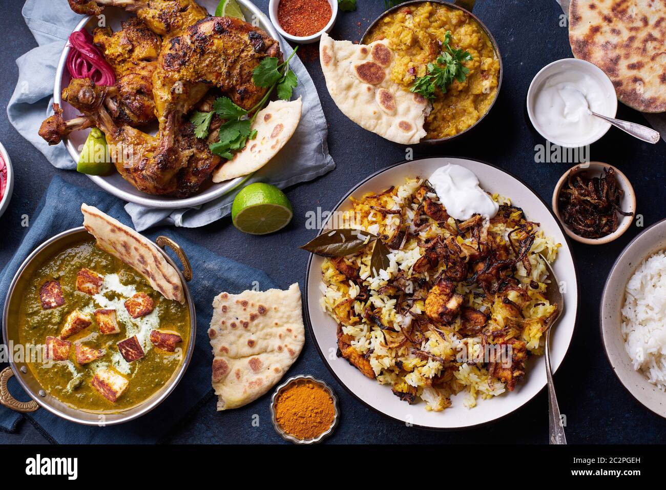 Indian cuisine dinner: tandoori chicken, biryani, red lentil curry dal ...