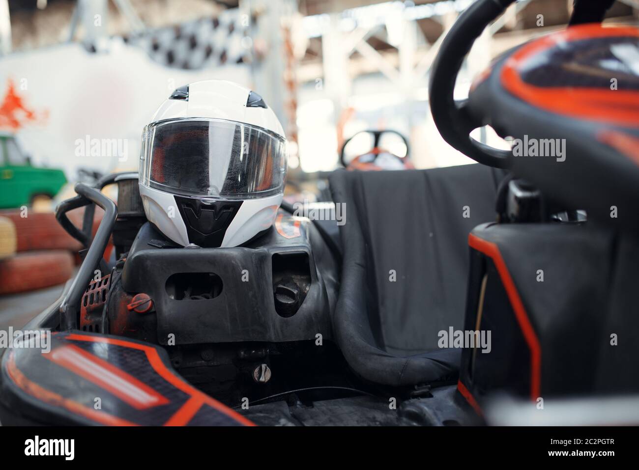 Helmet in go kart car closeup view, karting auto sport indoor. Speed ...