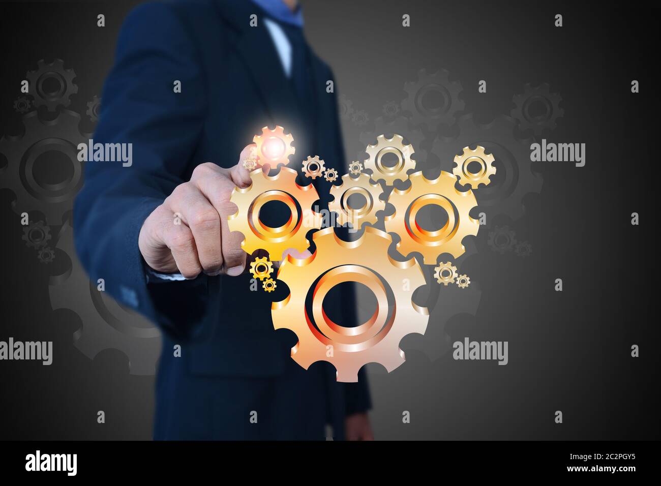 businessman showing gears cogs to success concept Stock Photo - Alamy