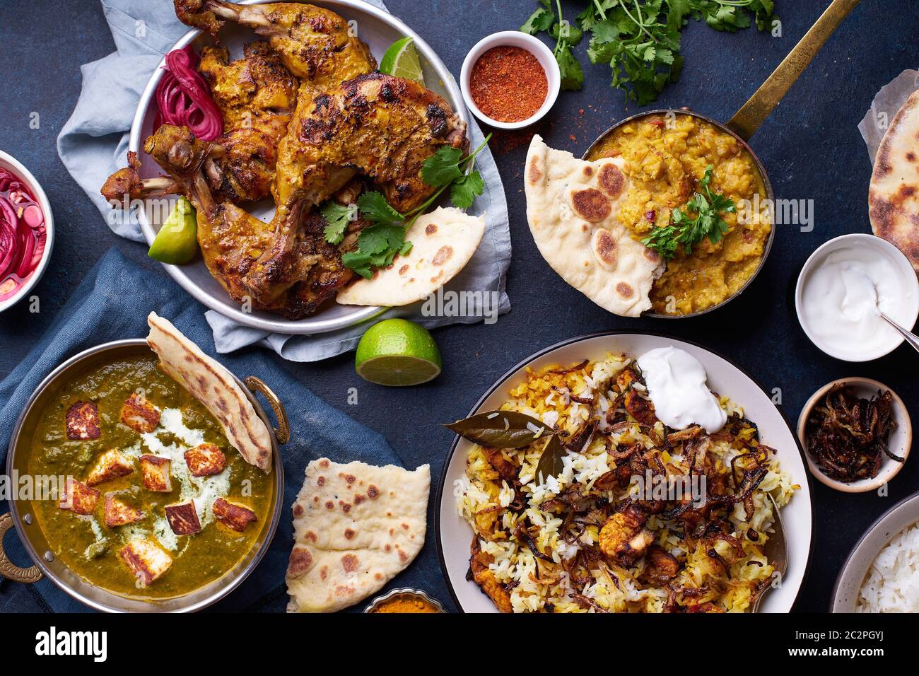 Indian cuisine dinner: tandoori chicken, biryani, red lentil curry dal ...