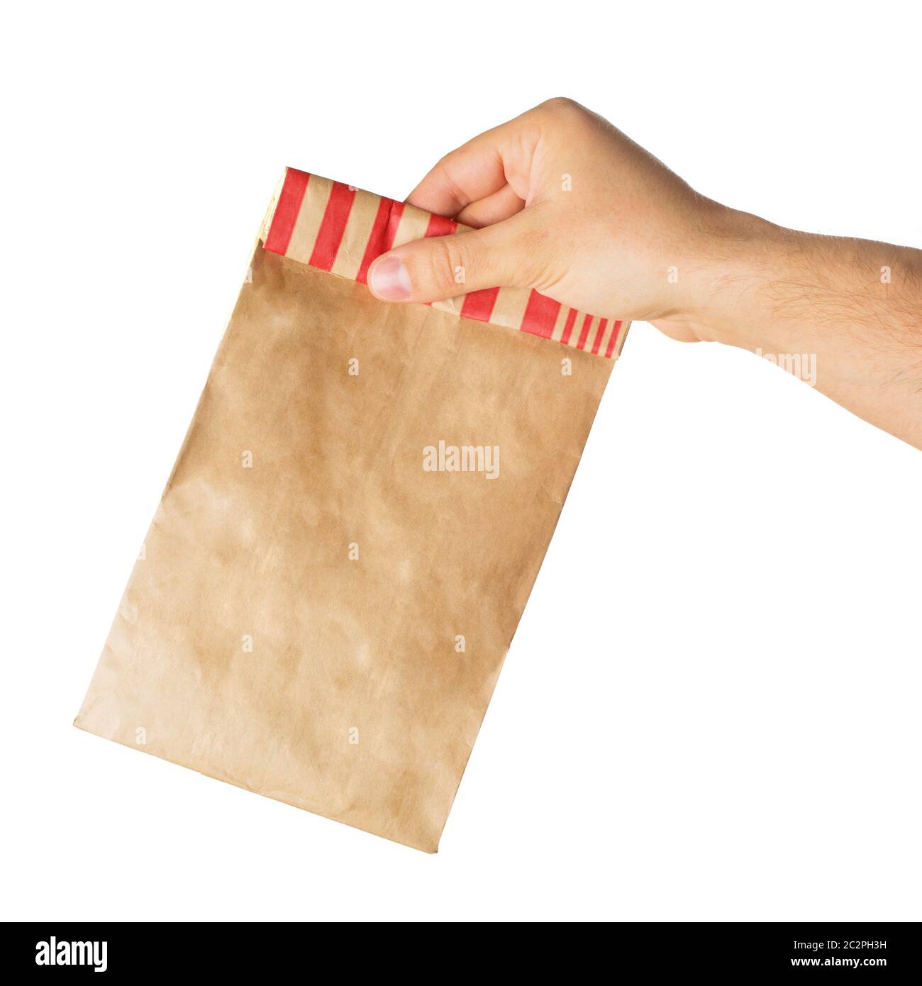 Hand holding or giving a brown paper bag Stock Photo - Alamy