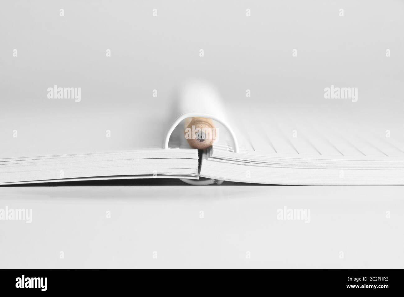 Open writing book with pencil Stock Photo - Alamy