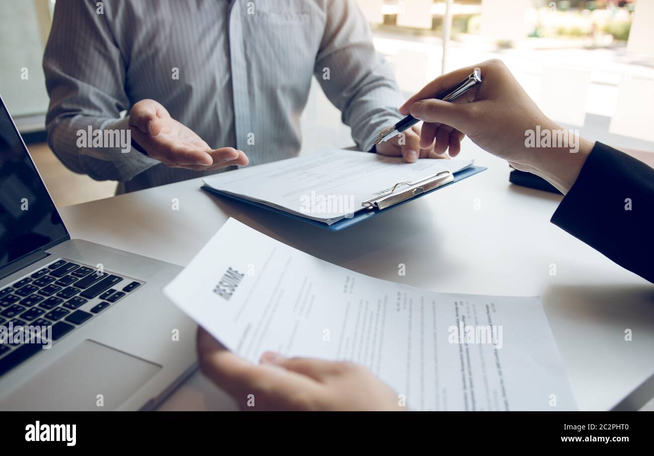 Male employee is explaining to the manager while being interviewed in ...