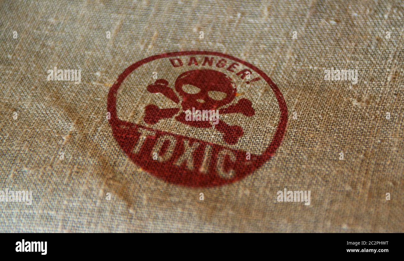 Toxic danger with skull stamp printed on linen sack. Poison warning ...