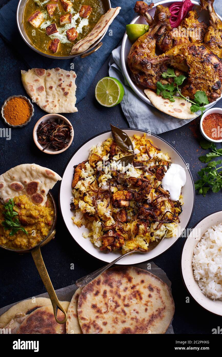 Indian cuisine dinner: tandoori chicken, biryani, red lentil curry dal ...