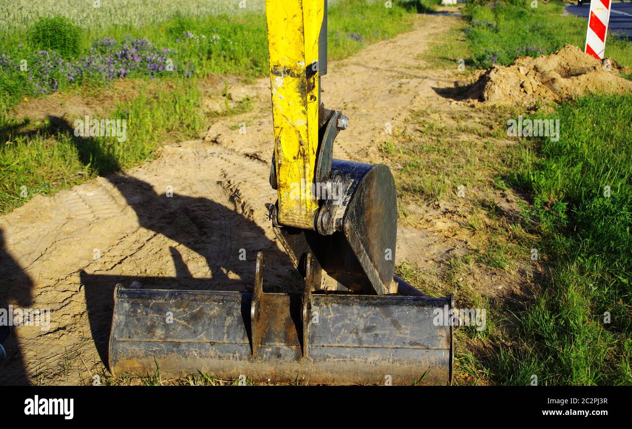Excavator at a construction site. Digger machine Stock Photo - Alamy