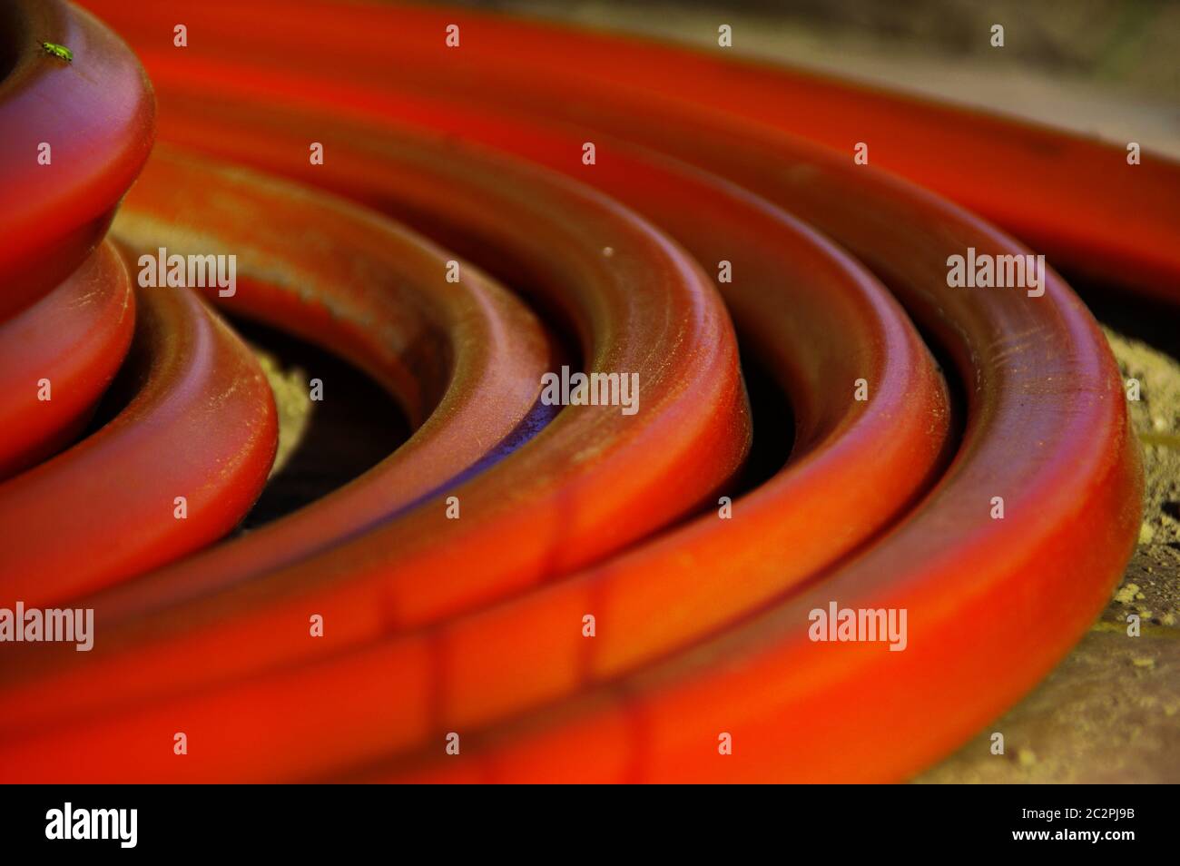 A roll of orange cables. Construction of optical fiber installation ...