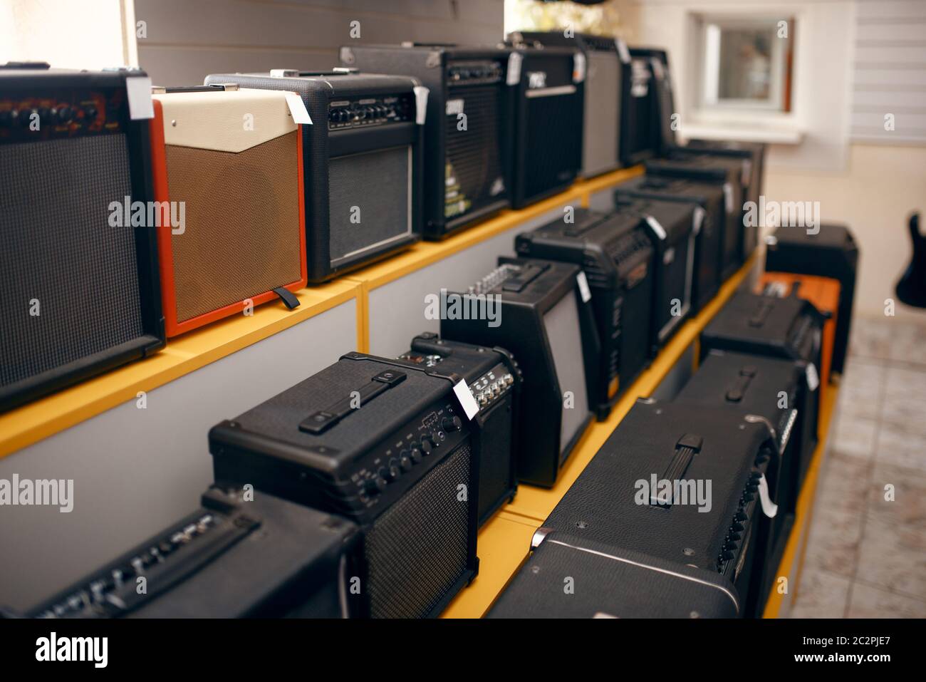Sound combo amplifiers on showcase in music store, nobody. Assortment ...