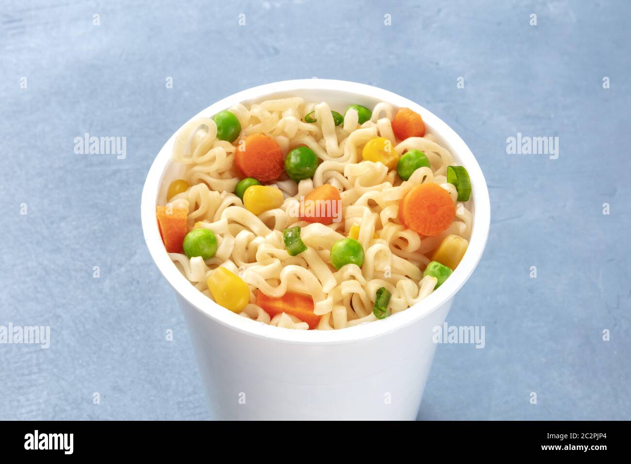 Ramen cup close-up, instant soba noodles in a plastic cup with ...