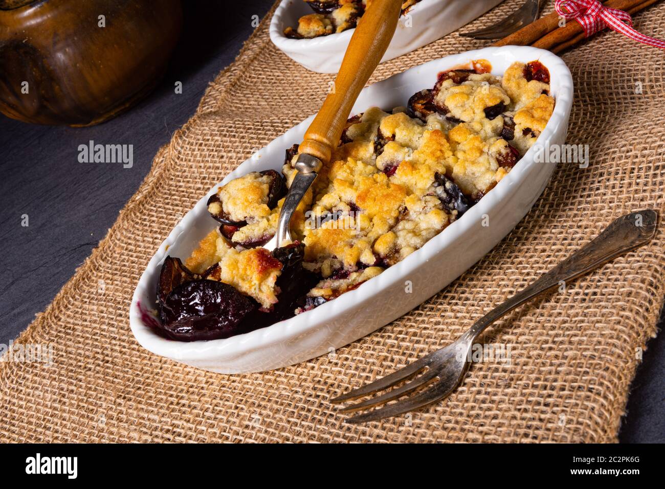 Cinnamon prunes with crumble Stock Photo - Alamy