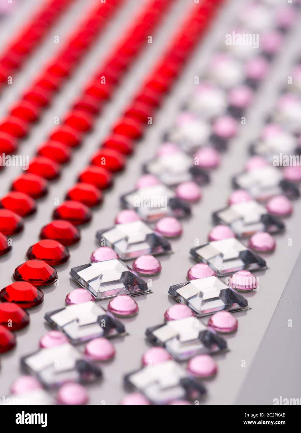 Various decorative gems in a row Stock Photo - Alamy