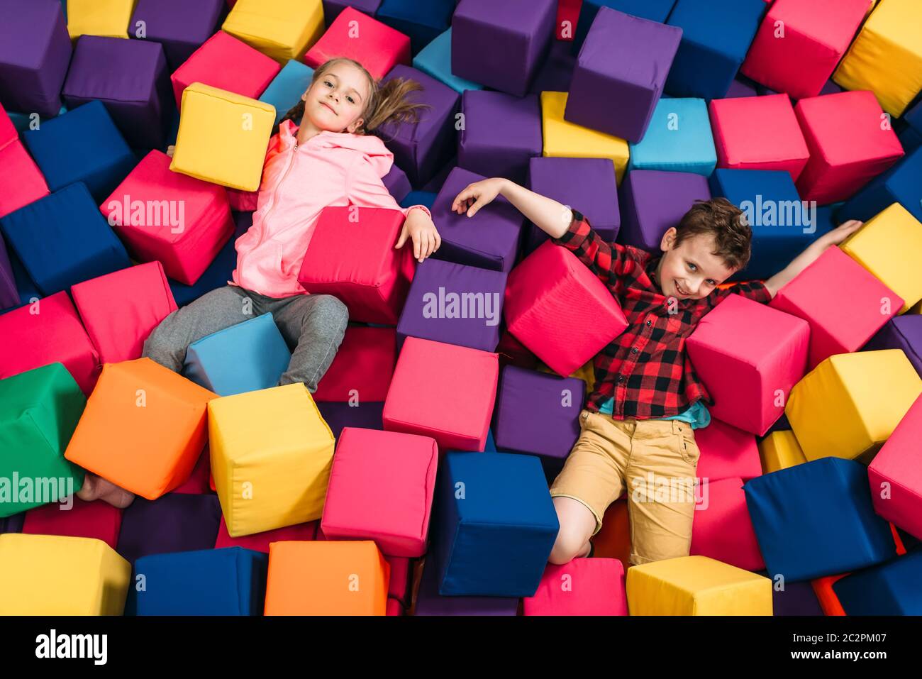 Smiling kids play in child entertainment center. Happy childhood Stock ...