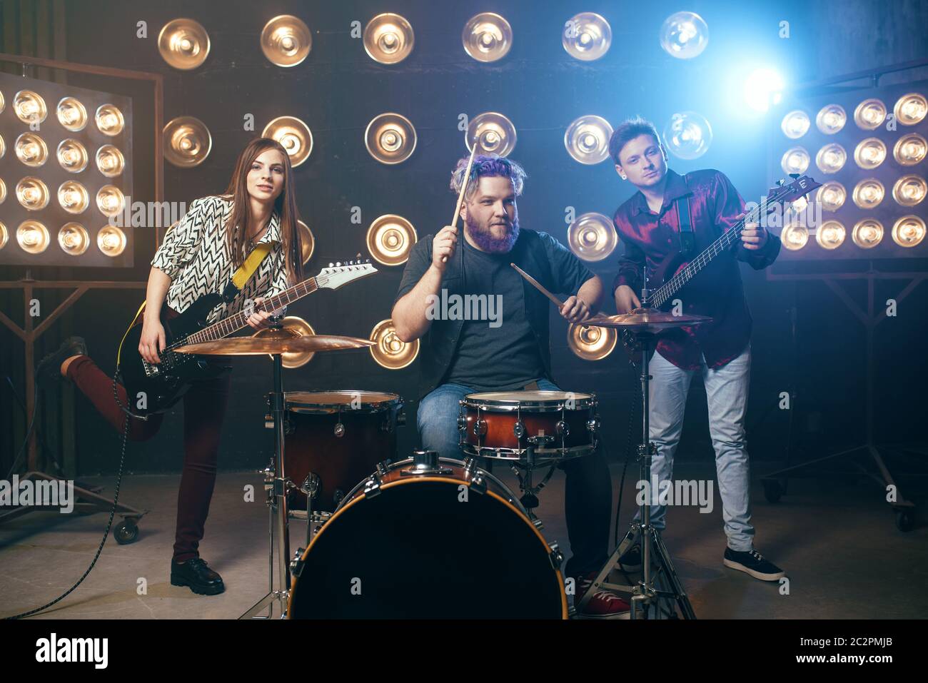 Musical performers on the stage with lights, vintage style. Guitarists ...