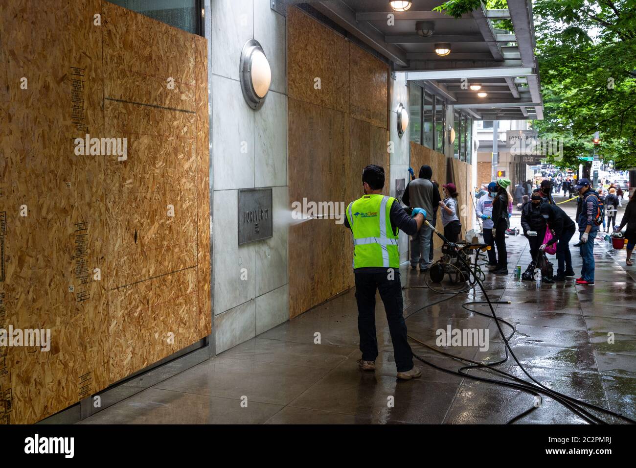 Seattle residents clean up the streets after the previous night's ...