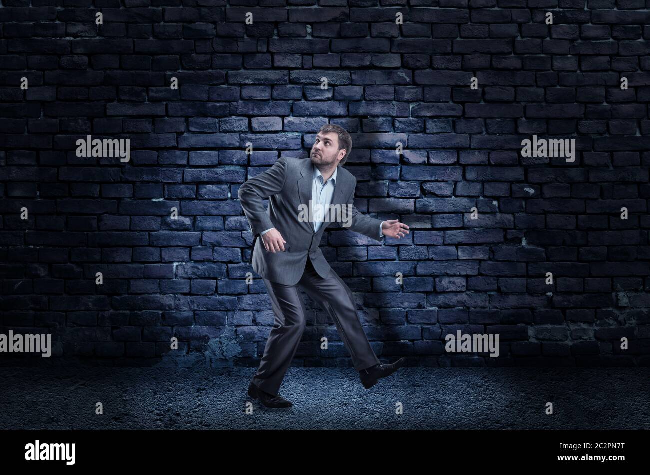 Man against wall scared hi-res stock photography and images - Alamy