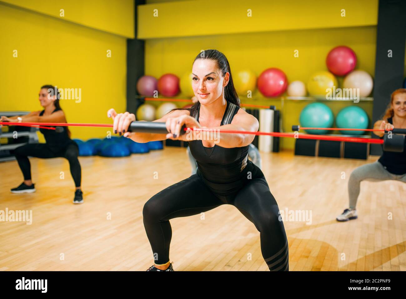 Women group on fitness training, aerobic. Female sport teamwork in gym ...