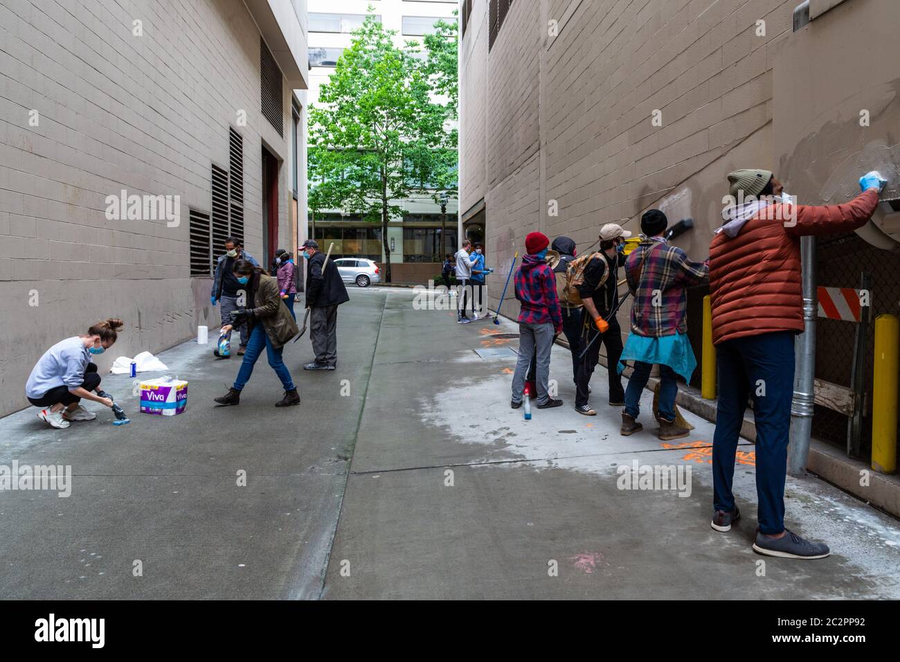 Seattle residents clean up the streets after the previous night's ...