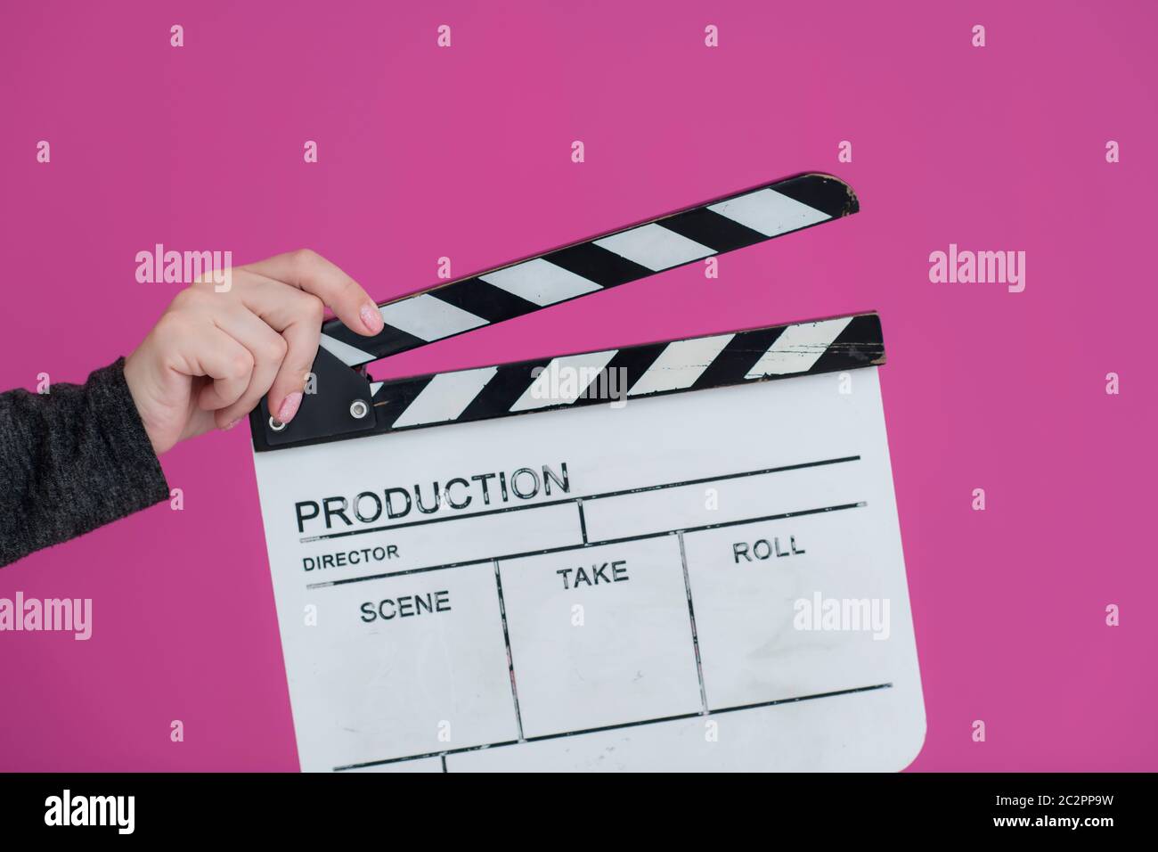 movie clapper on pink background Stock Photo - Alamy