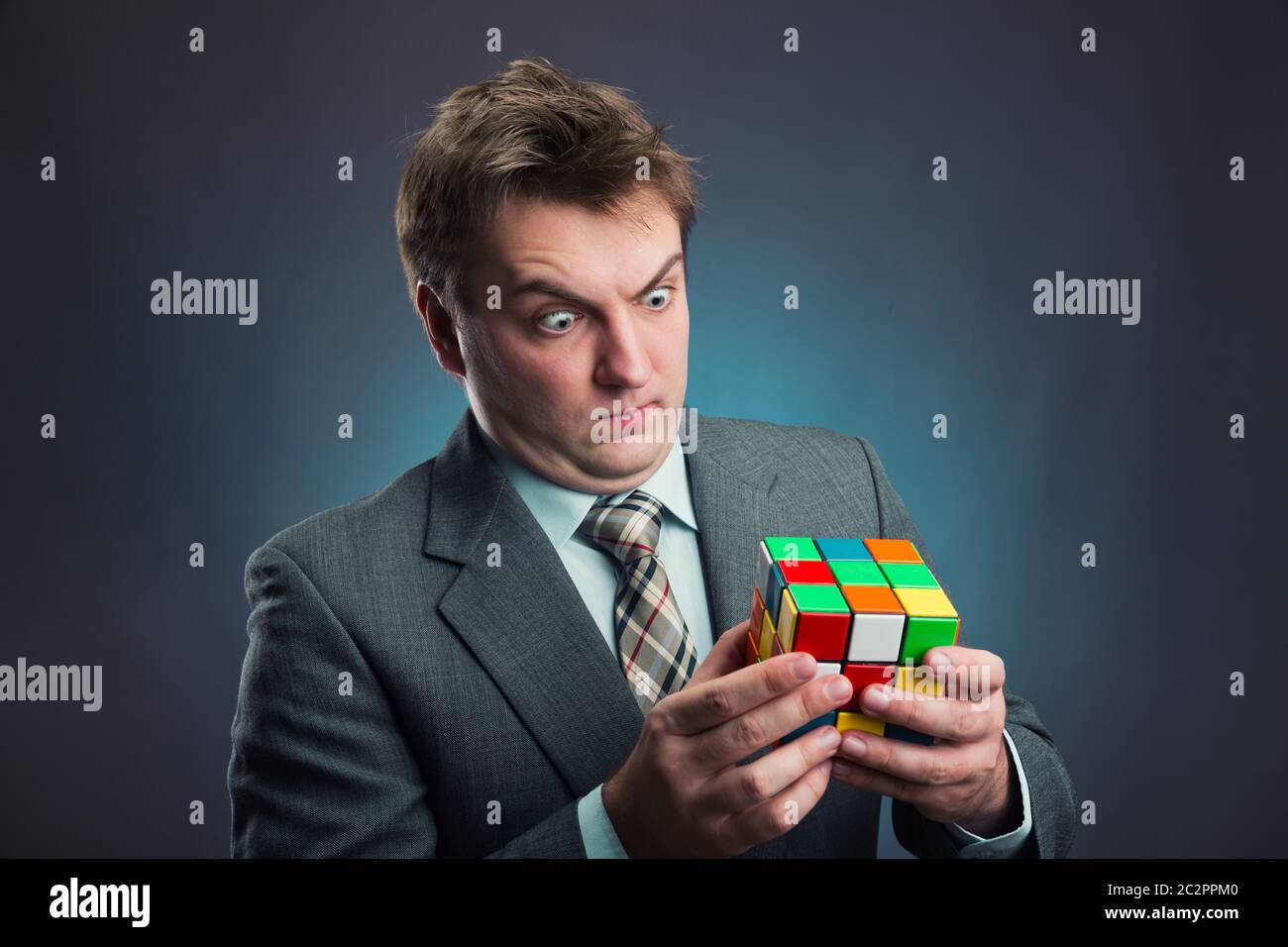 Adult with rubik cube hi-res stock photography and images - Alamy