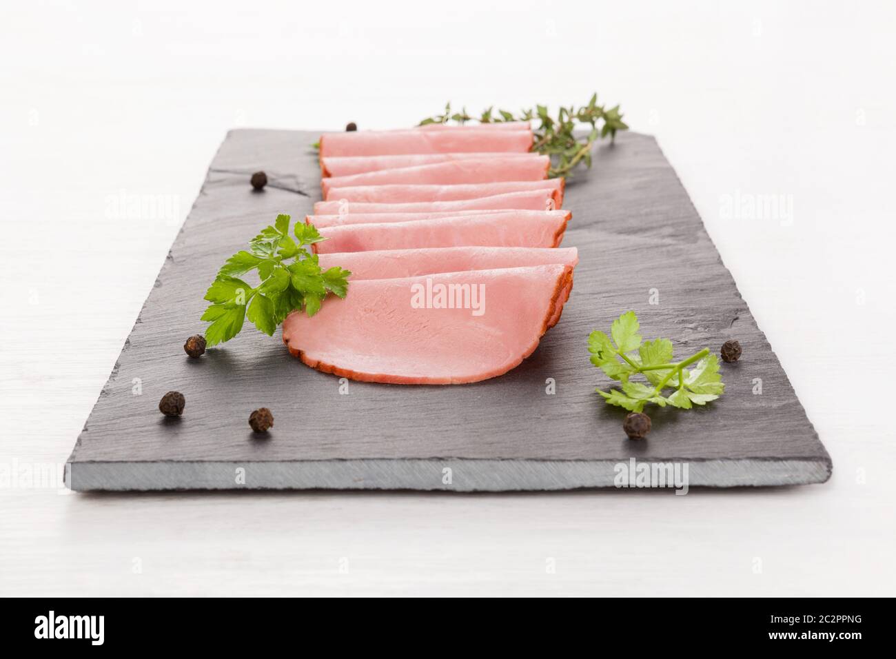 Delicious duck ham served with fresh herbs. Culinary appetizer Stock ...