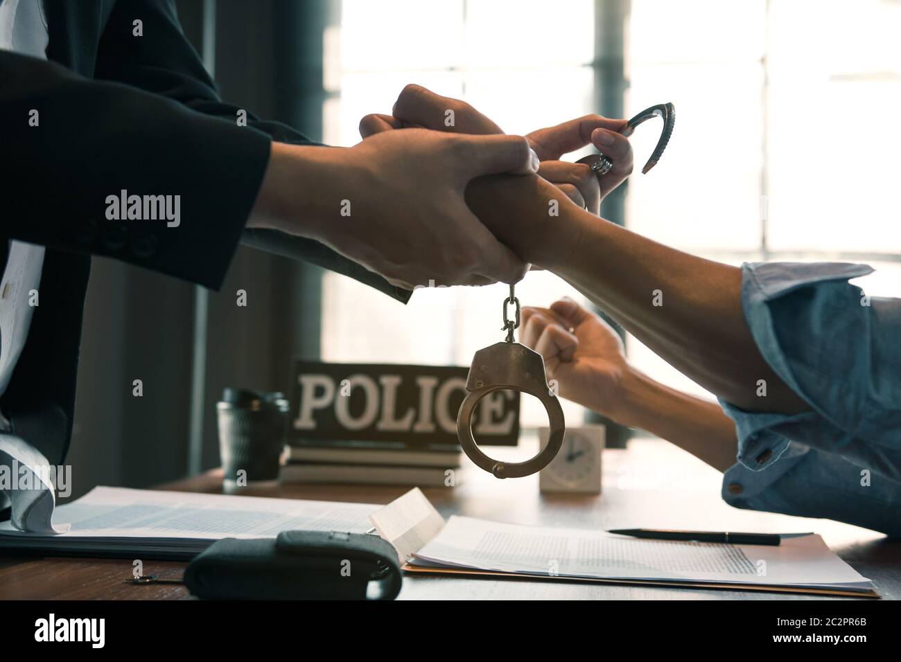 Handcuffed suspect interrogation room hi-res stock photography and ...