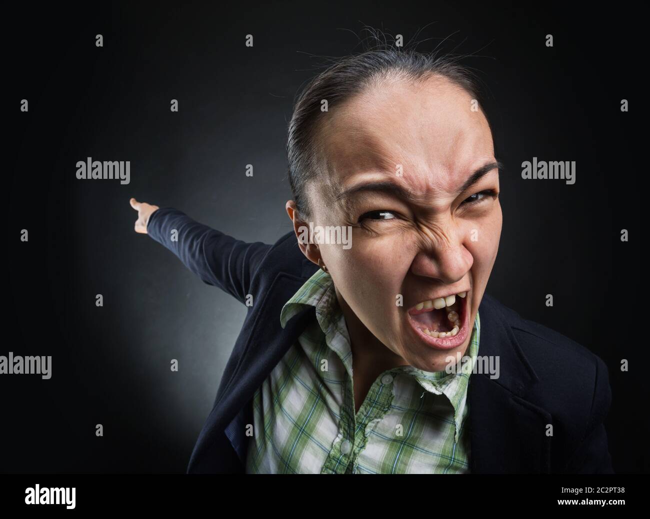Angry businesswoman crying and pointing back Stock Photo - Alamy