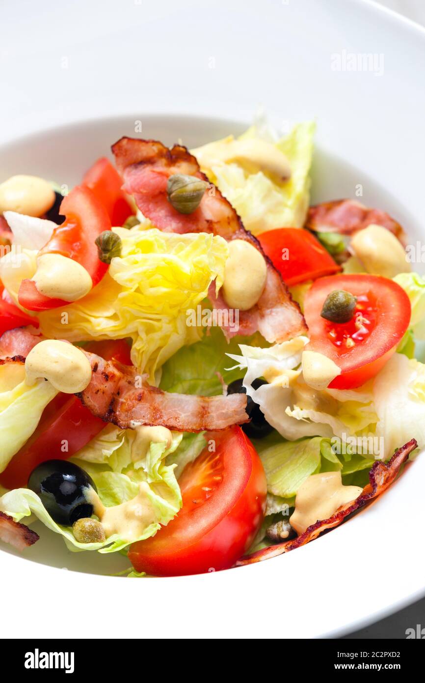 vegetable salad with bacon and capers Stock Photo - Alamy