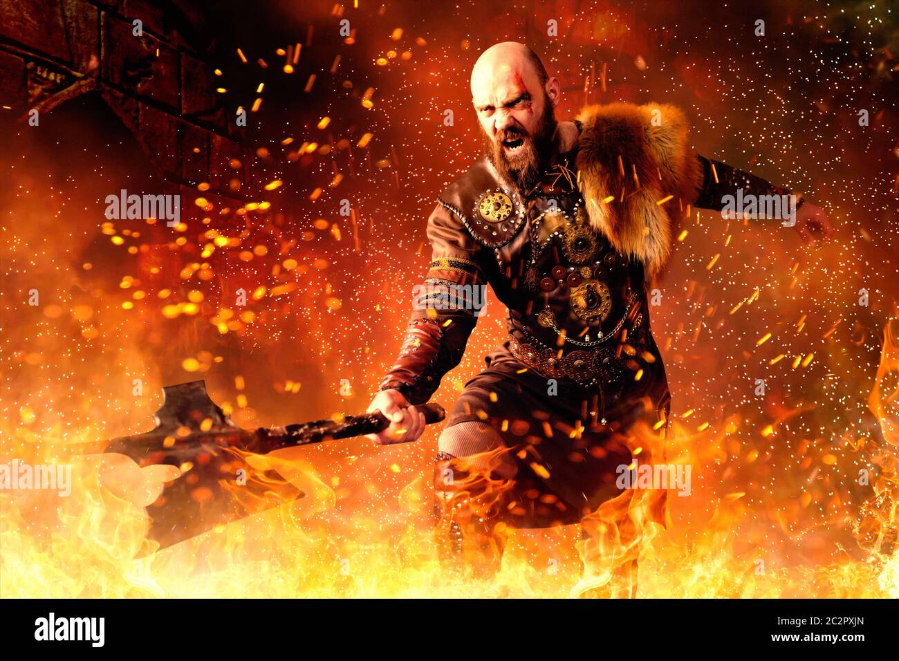 Angry viking with axe dressed in traditional nordic clothes standing in ...