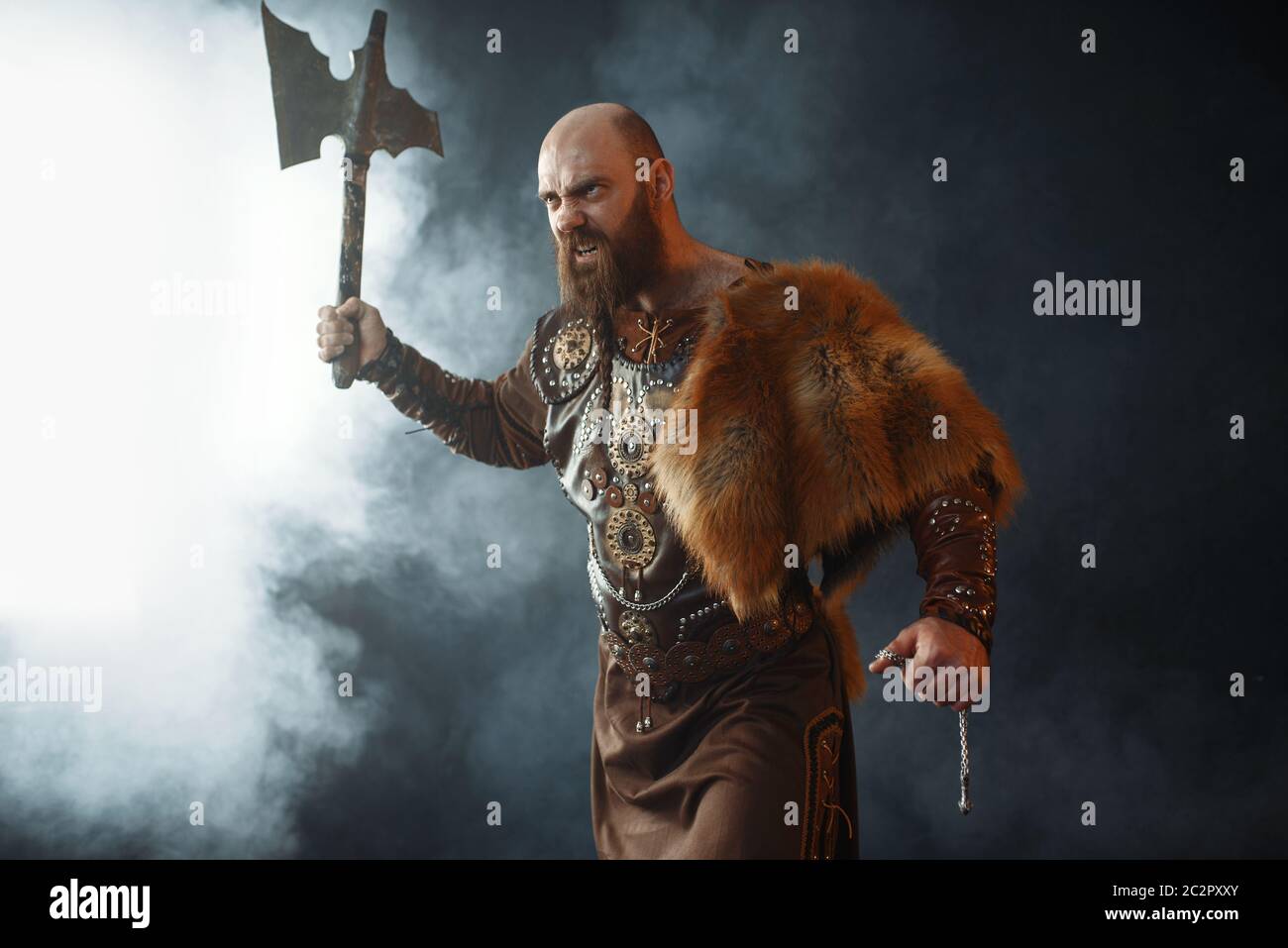 Bearded viking with axe enters the battle, barbarian image. Ancient ...