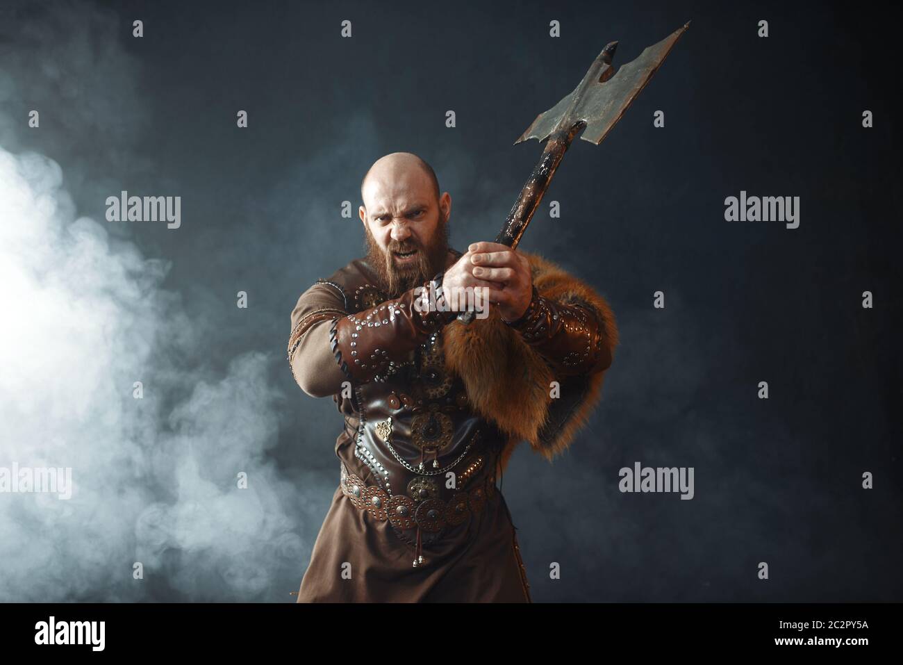Bearded viking with axe enters the battle, barbarian image. Ancient ...