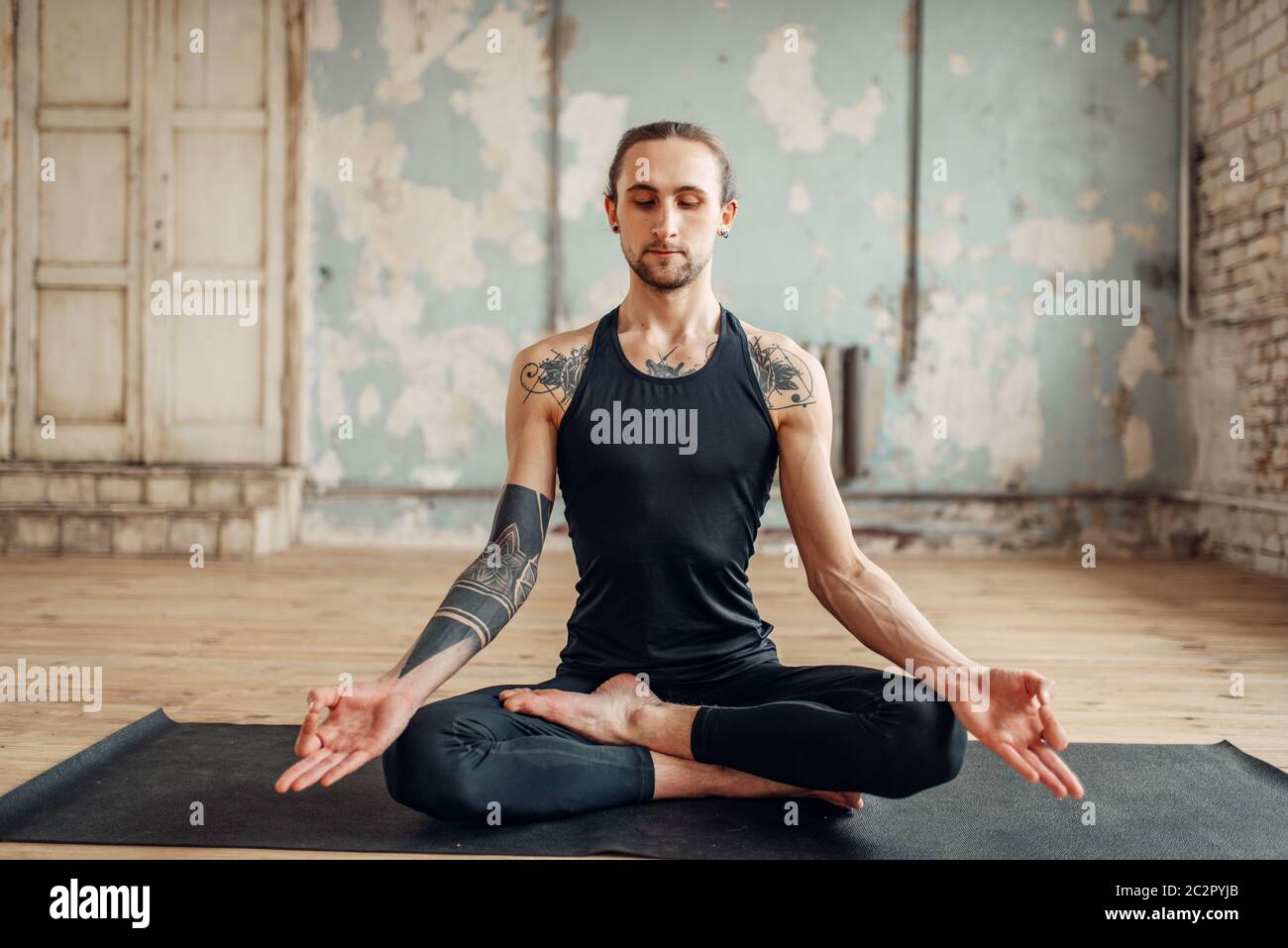 Male yoga, meditation in asana position, full relaxation. Fit workout ...