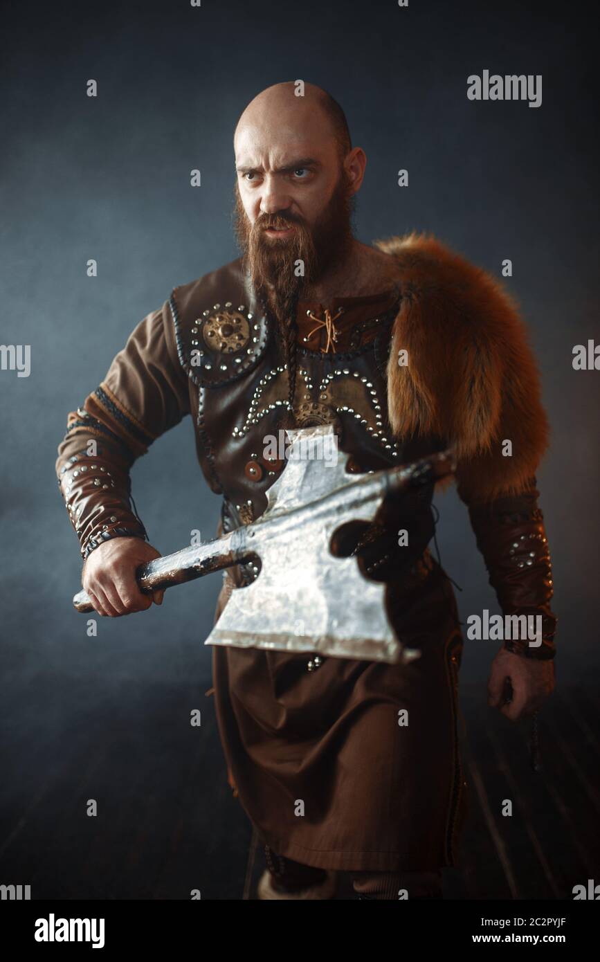 Bearded viking with axe enters the battle, barbarian image. Ancient ...