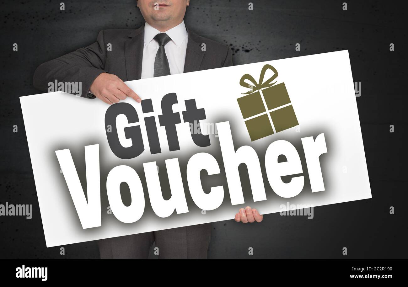 Gift Voucher poster is held by businessman Stock Photo - Alamy
