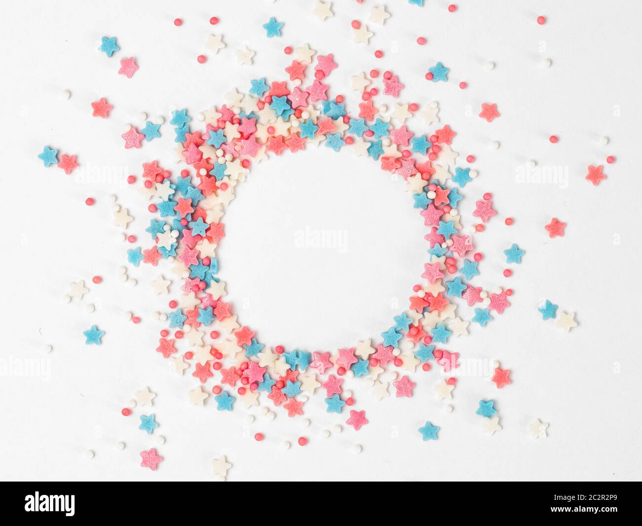 Festive border frame of colorful pastel sprinkles on white background ...