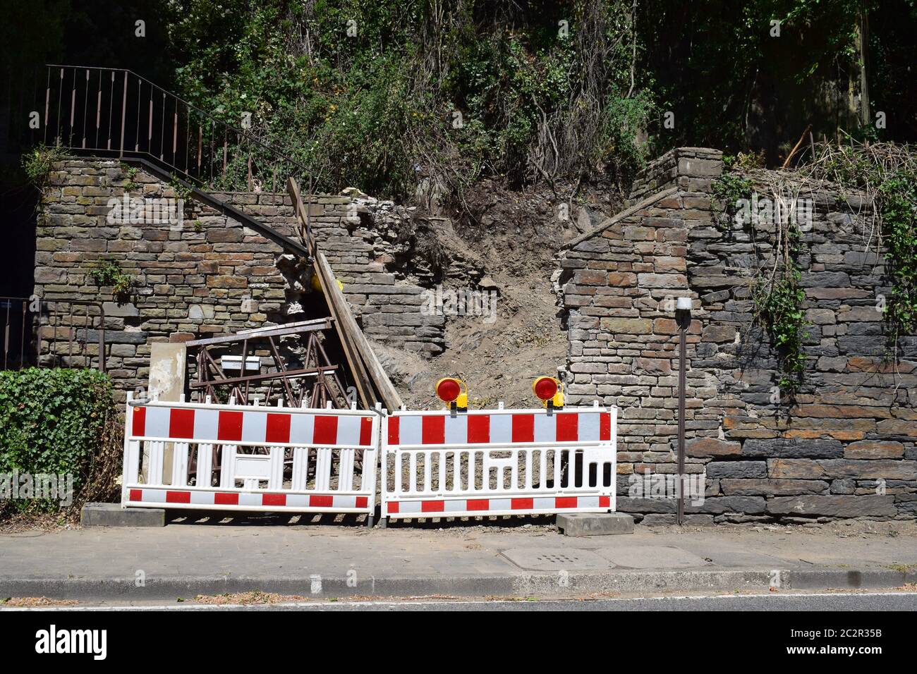 crumbling wall with barrier Stock Photo - Alamy