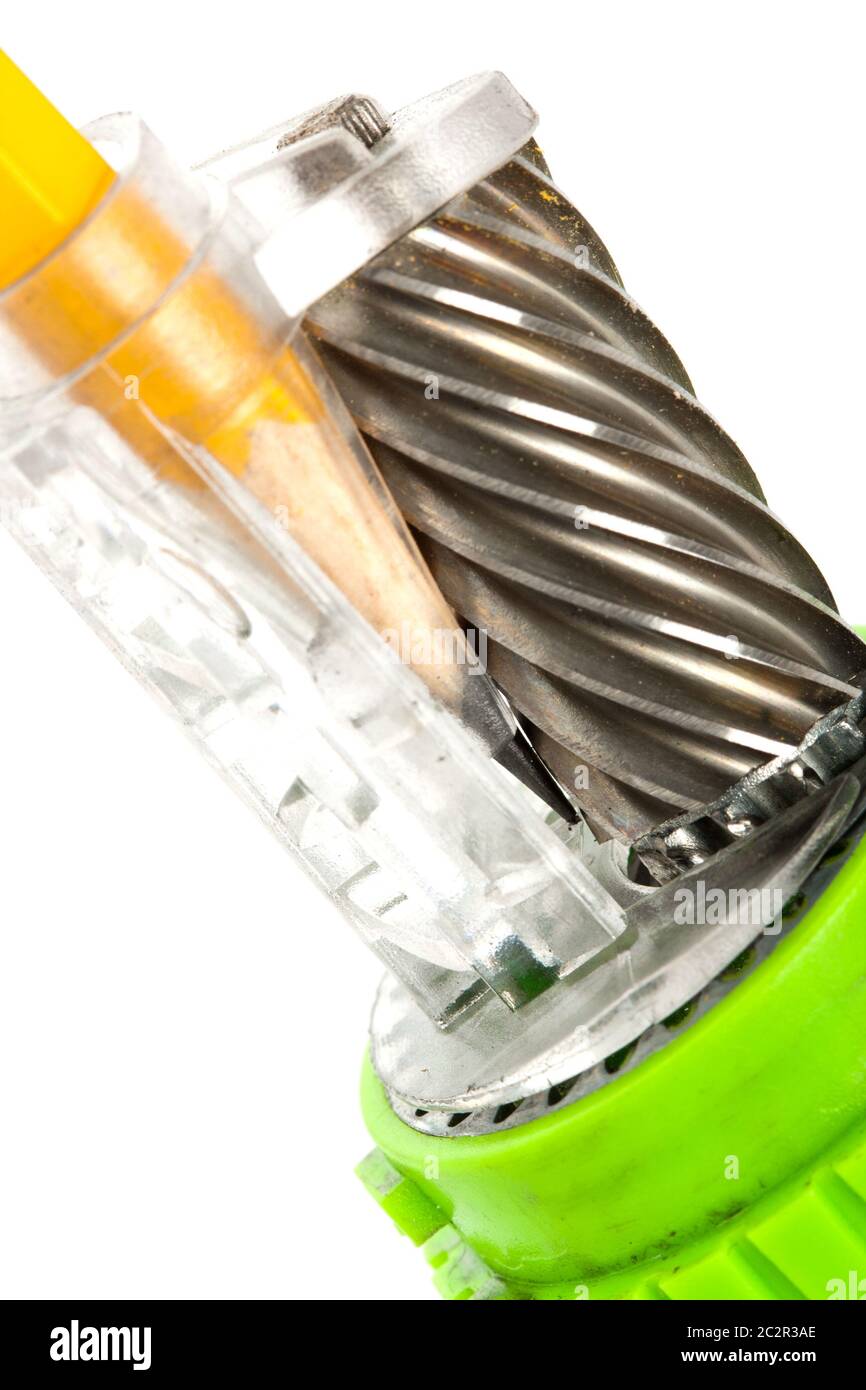 Close-up of pencil sharpener mechanism at work Stock Photo - Alamy