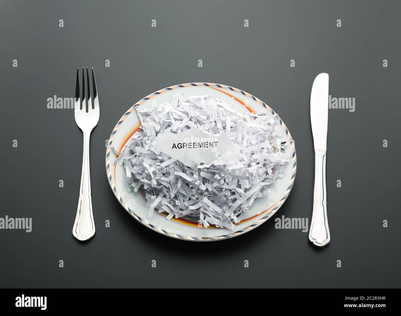 Table set with shredded agreement on the plate Stock Photo - Alamy