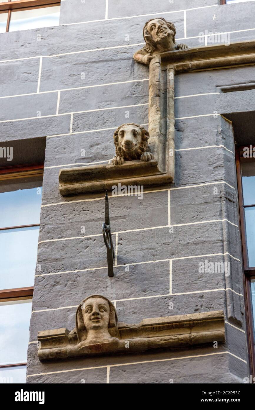 Intricate stone carvings adorning the facade of House Tavel at the ...