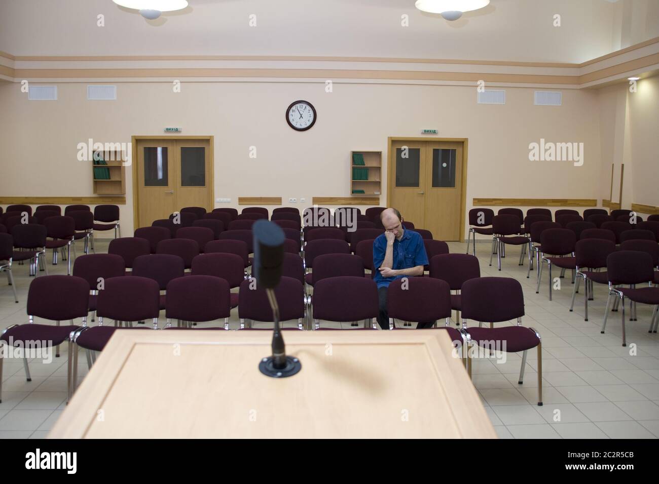 Boring lecture. Alone sleeping student in empty auditorium Stock Photo ...