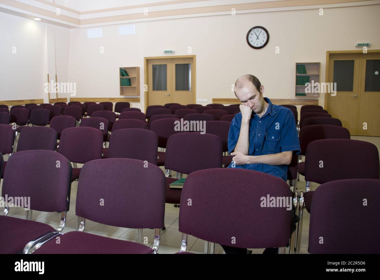Boring lecture. Alone sleeping student in empty auditorium Stock Photo ...