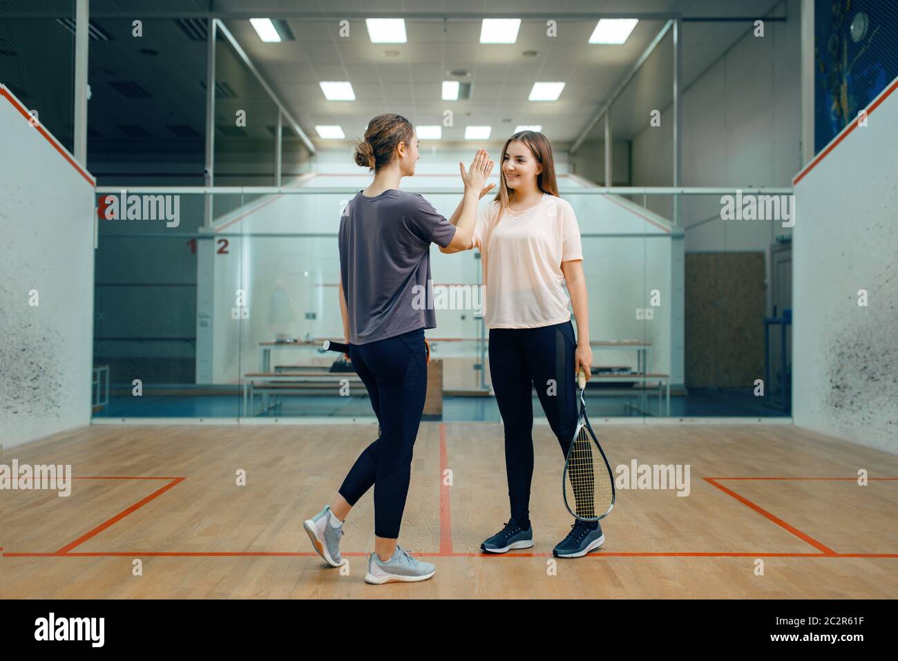 Two female squash players before competition. Girls on training, active ...