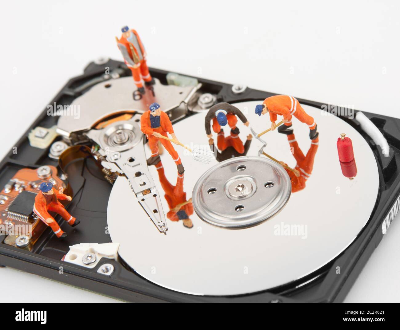 IT support. Workers repairing hard disk drive Stock Photo - Alamy