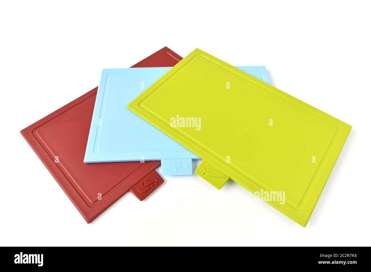 Colored plastic cutting boards on a light background Stock Photo - Alamy