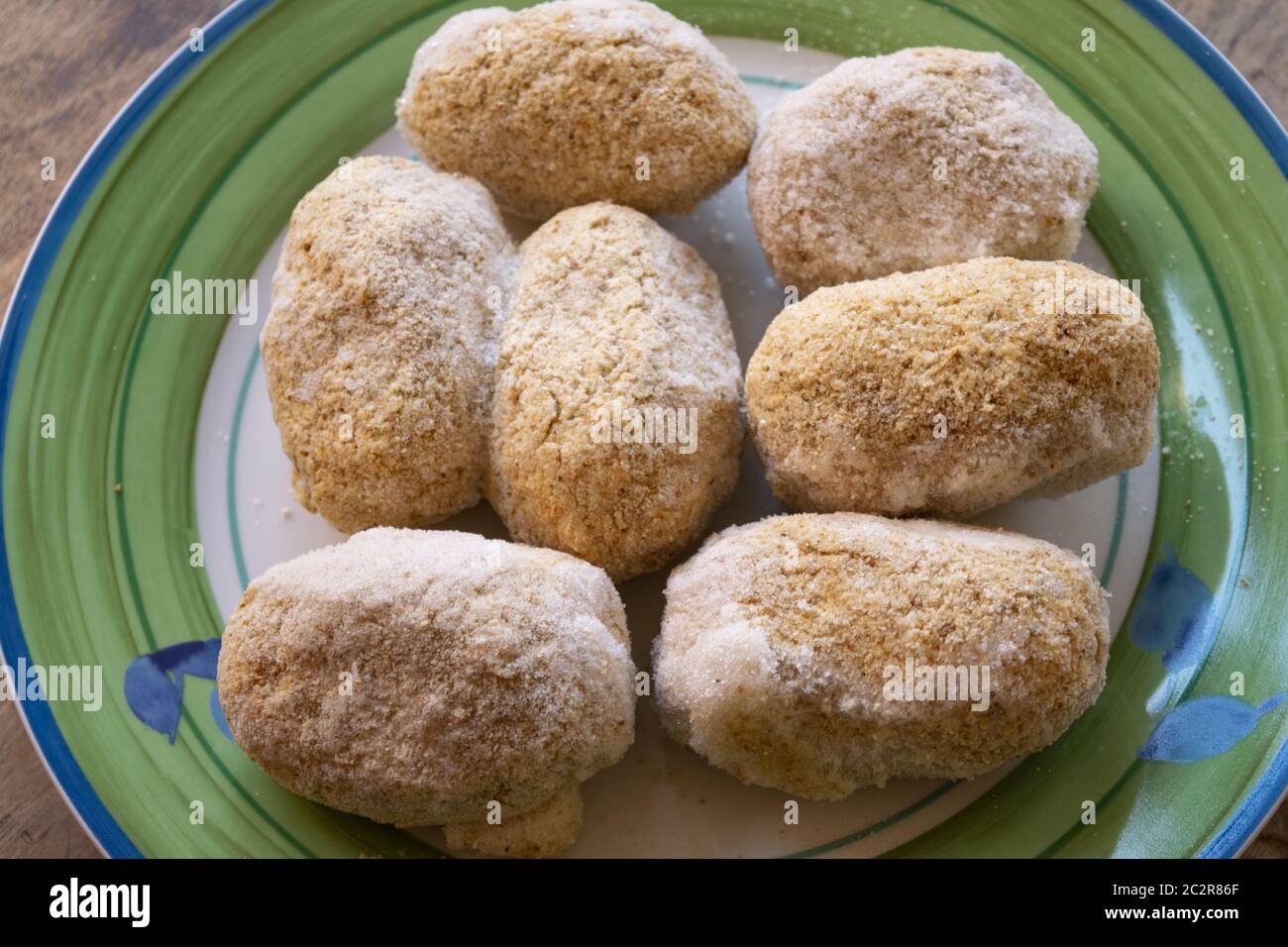deep-frozen arancini rice in a dish ready to be fried Stock Photo - Alamy