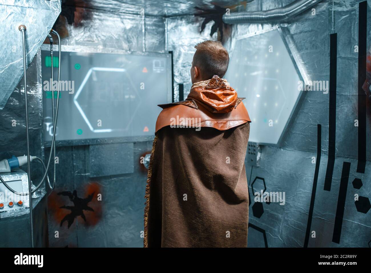 Intergalactic space scientist enter data on the teleport board ...