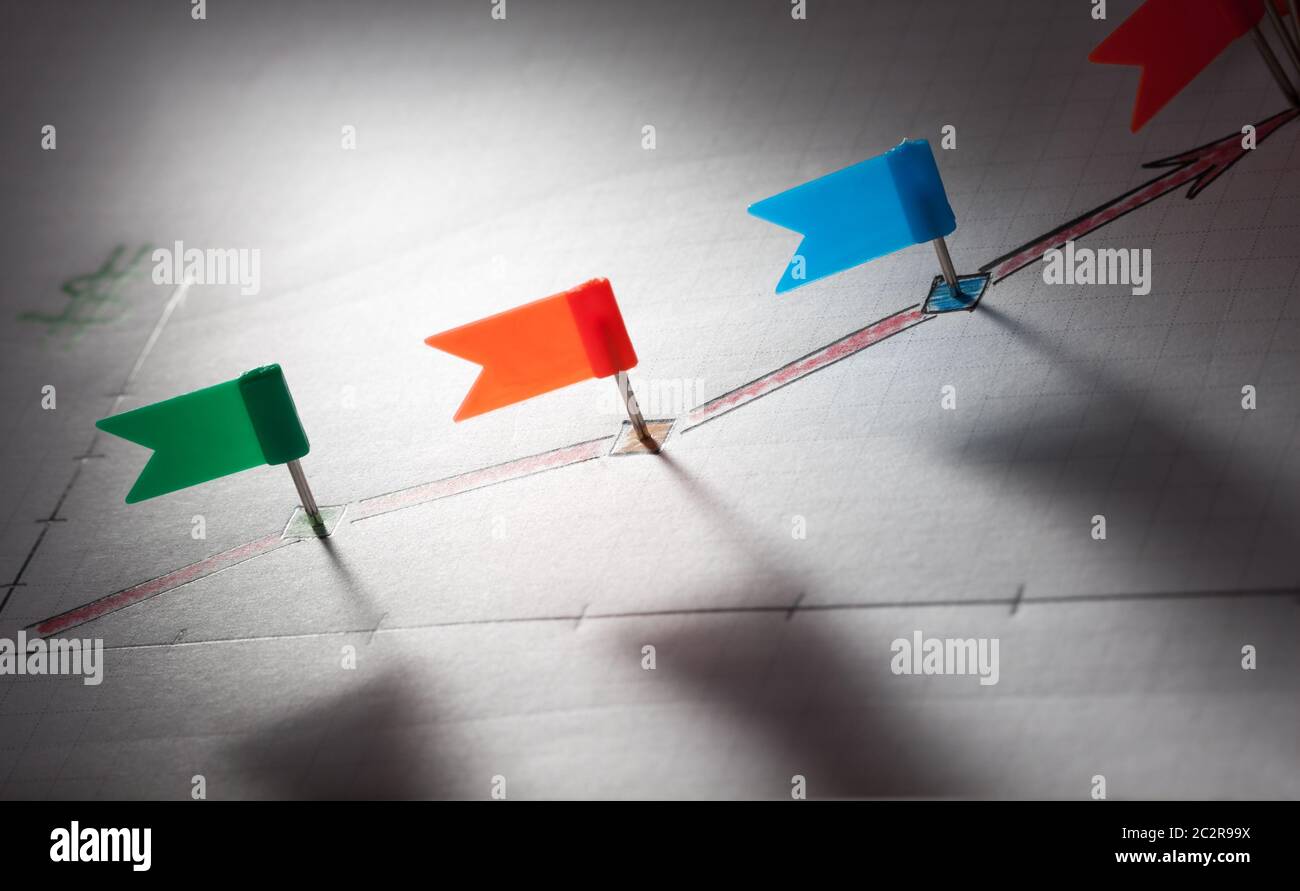 Colorful pins on sketched red arrow points Stock Photo - Alamy