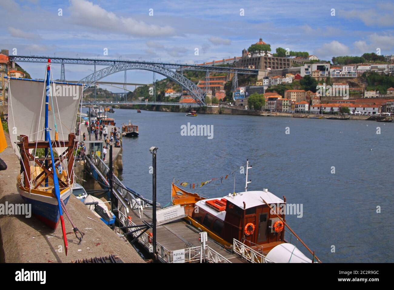 The small and the big boats with the historic bridge Stock Photo - Alamy