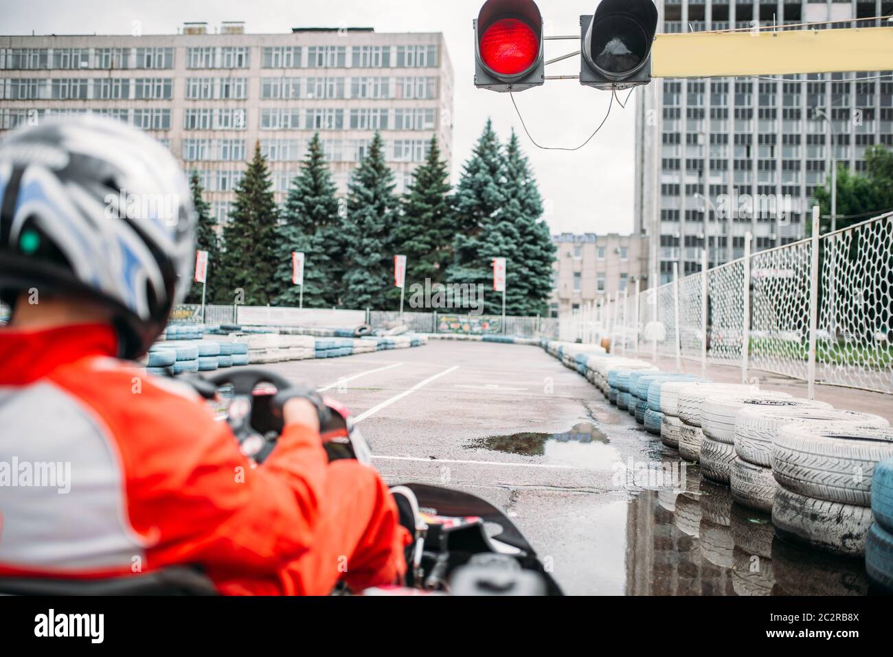 Karting racer, go kart driver on start line, back view. Carting speed ...