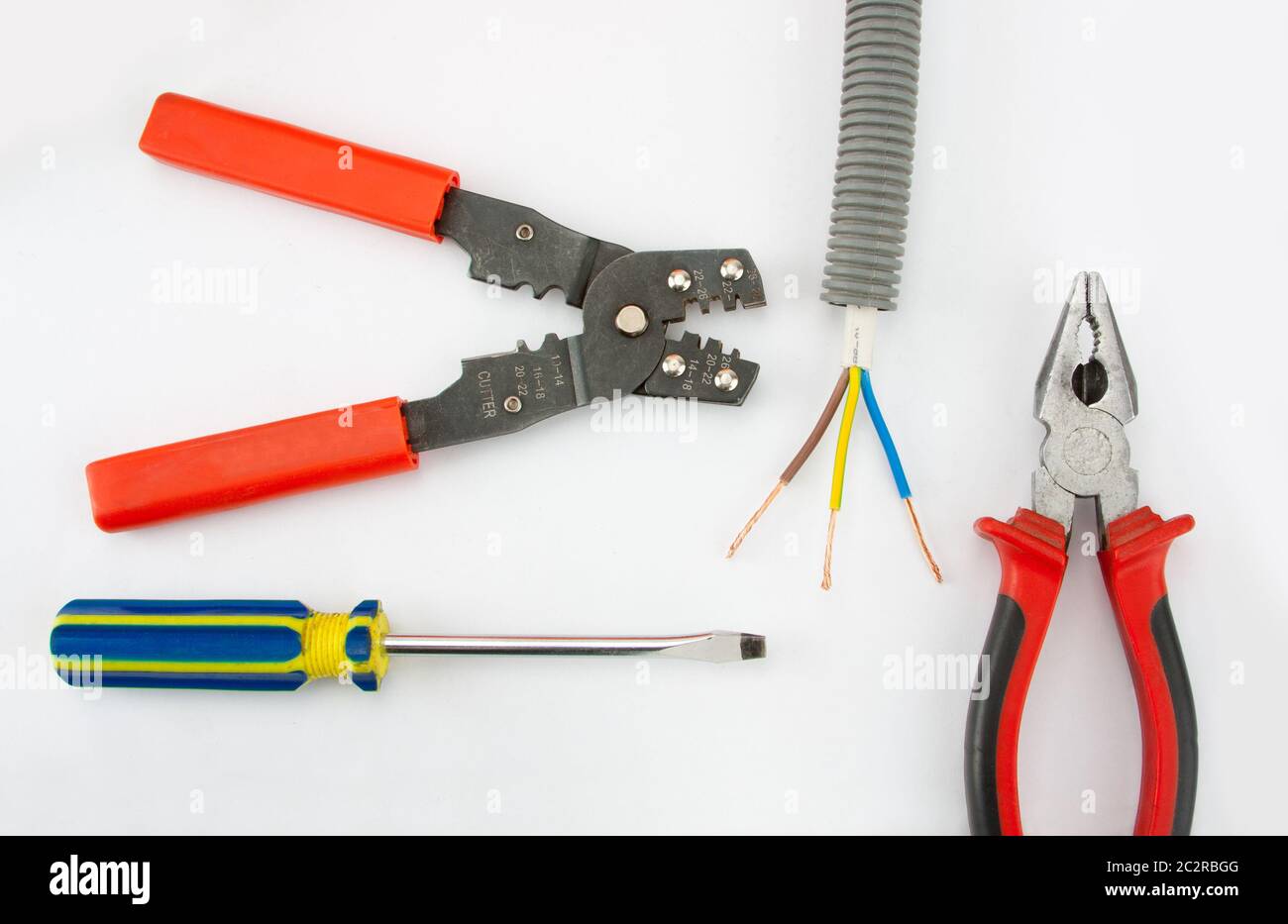 Electrician's tools. Pliers, cable, cutter and screwdriver Stock Photo ...